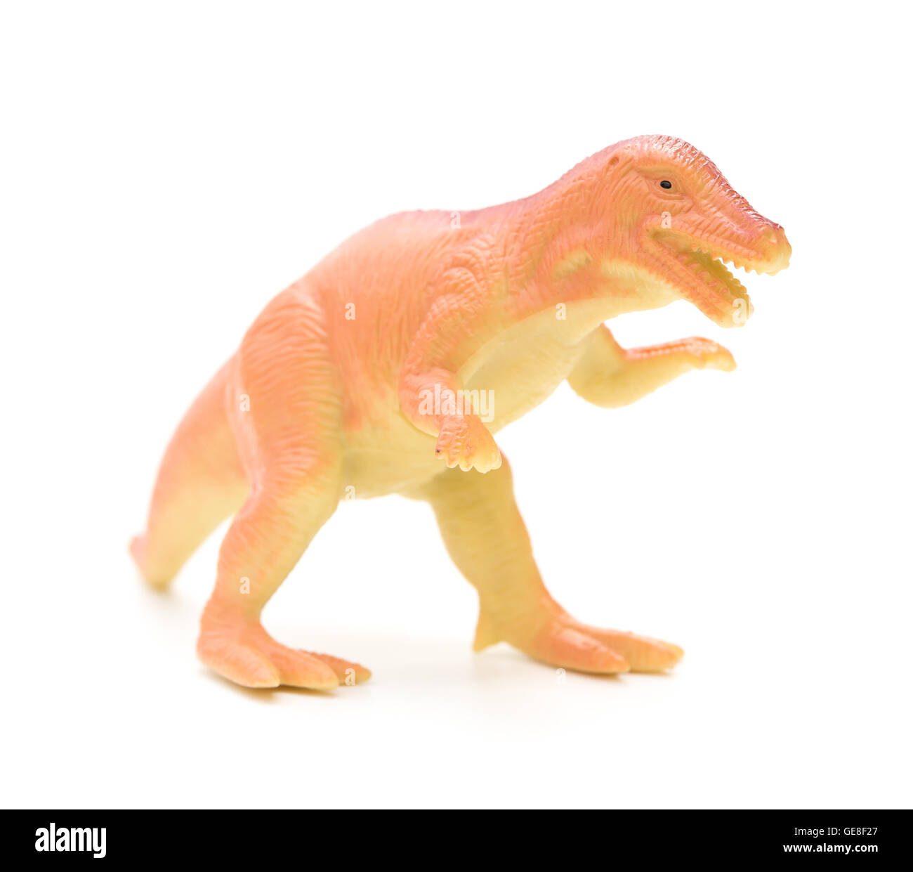 orange plastic dinosaur toy on a white background Stock Photo - Alamy