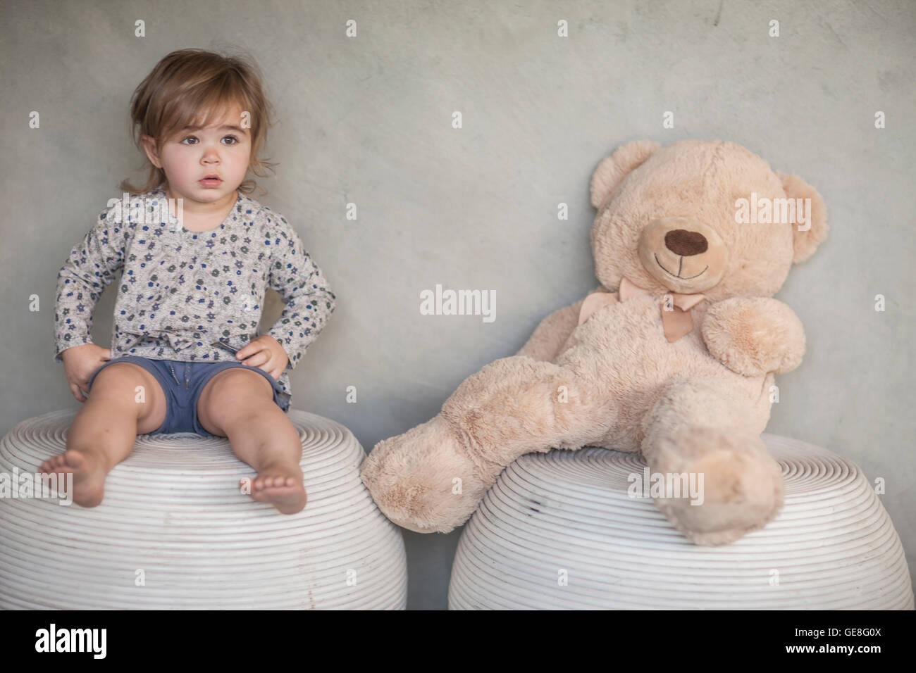 Baby sitting on stool hi-res stock photography and images - Alamy