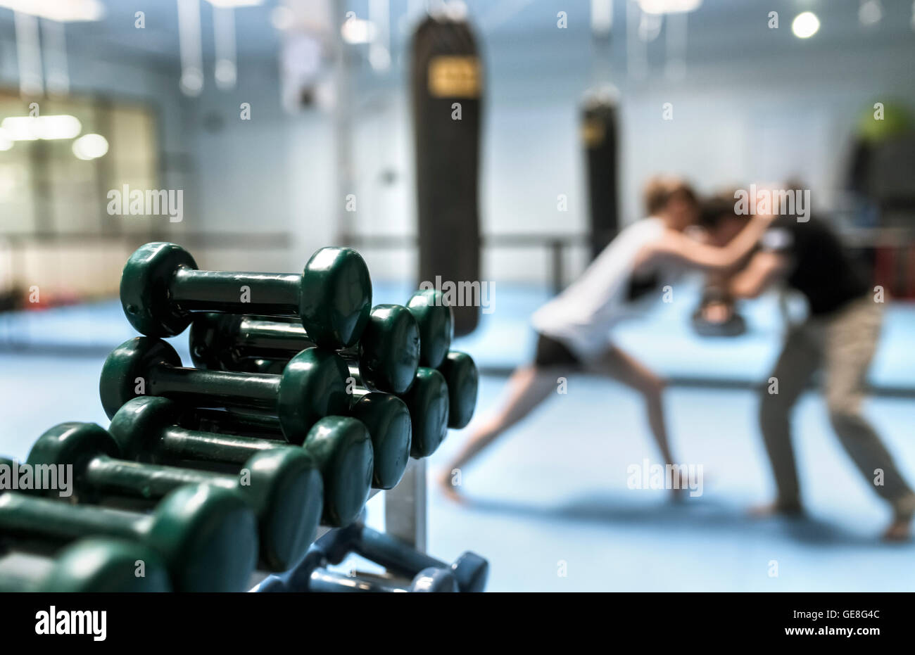 Young woman in gym doing self defense training Stock Photo - Alamy