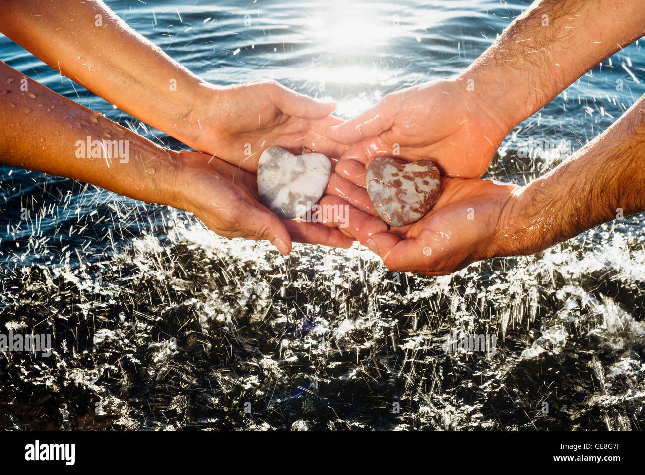 Hands holding stones Stock Photo - Alamy