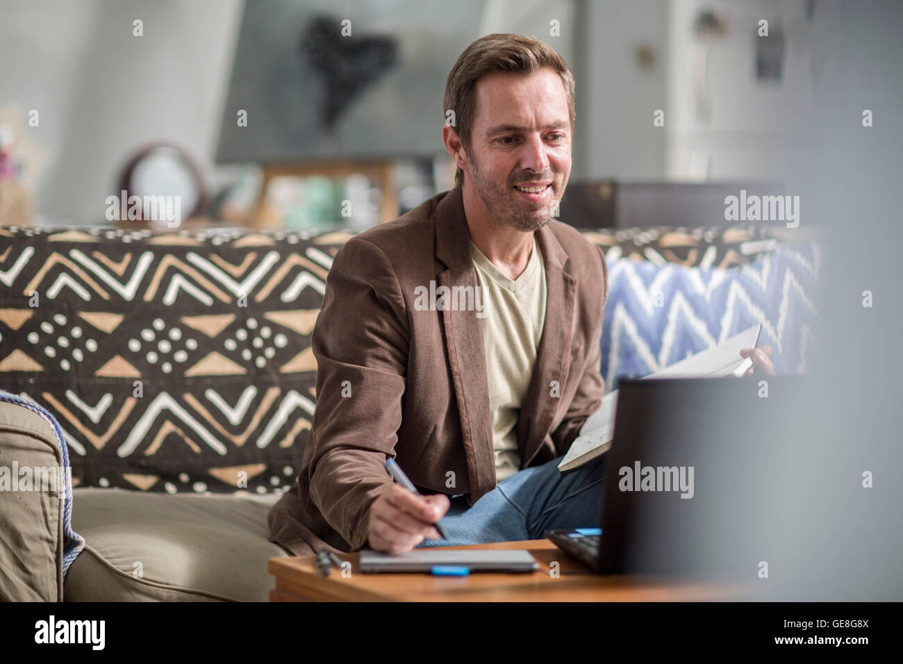 Man working in home studio Stock Photo - Alamy