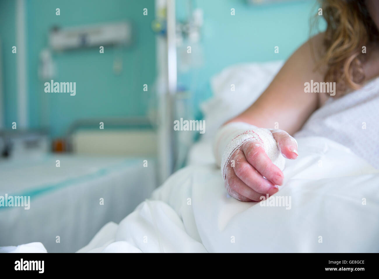 Woman in the hospital, operated hand Stock Photo - Alamy