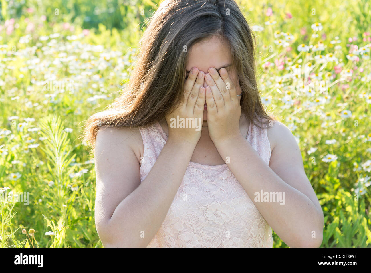 Sad Girl In Field Of Flowers