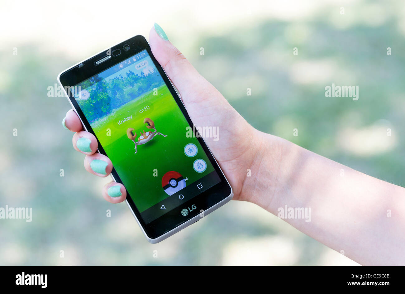 Sofia, Bulgaria - July 23, 2016: Woman holds in her hand a mobile phone ...