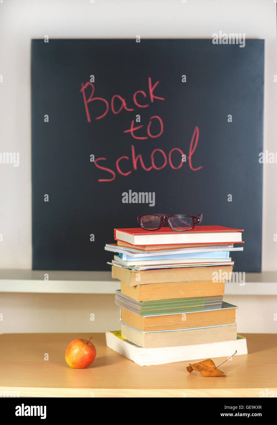 Books in pile glasses hi-res stock photography and images - Alamy