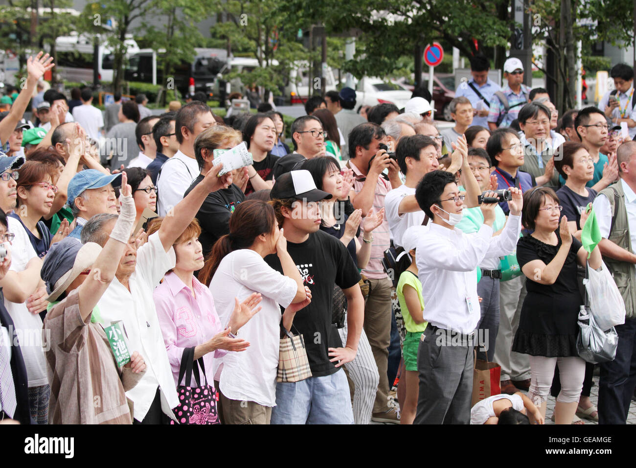 People watch and listen as former Defense Minister Yuriko Koike ...