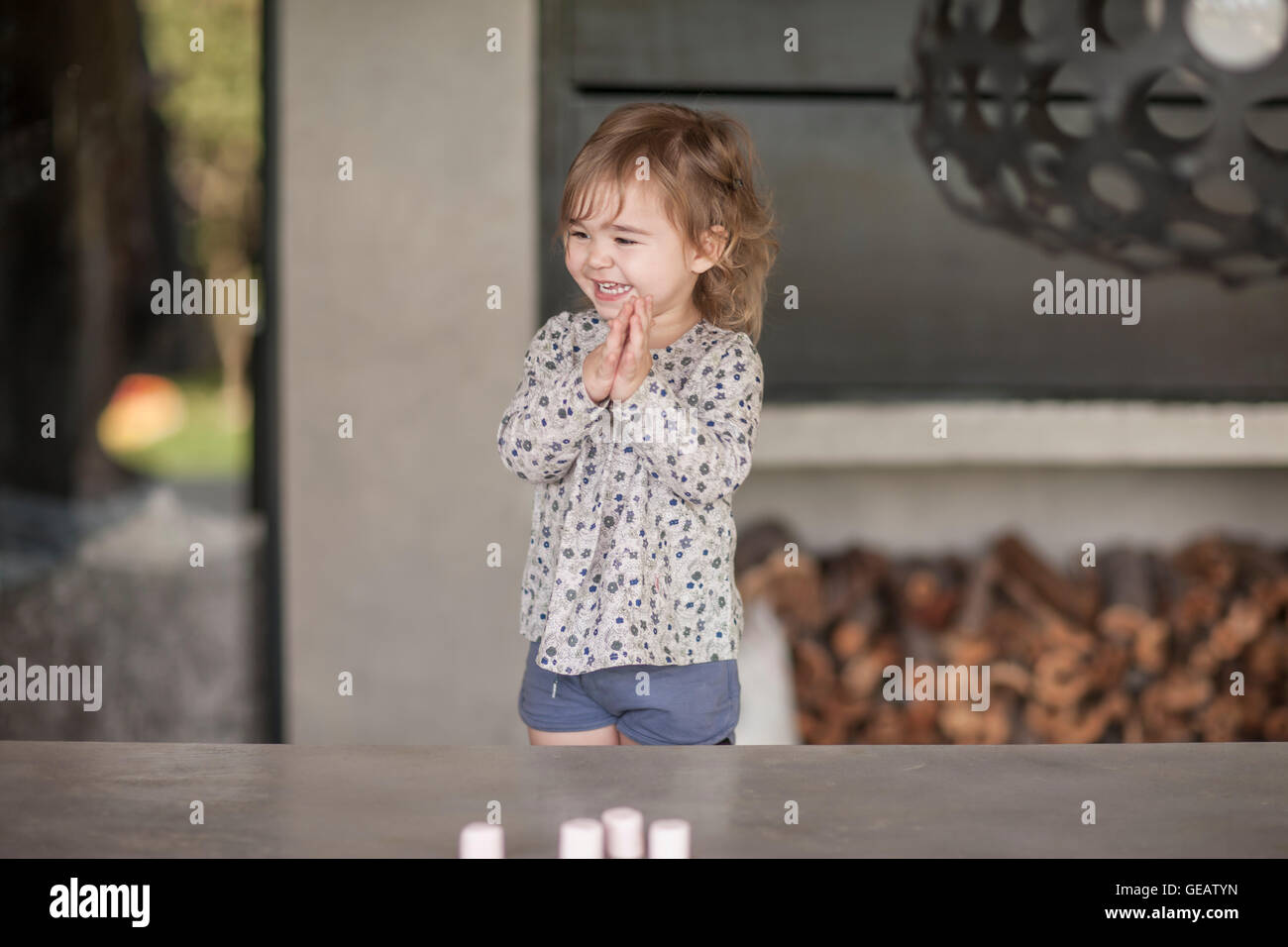 Happy little girl clapping hands Stock Photo - Alamy
