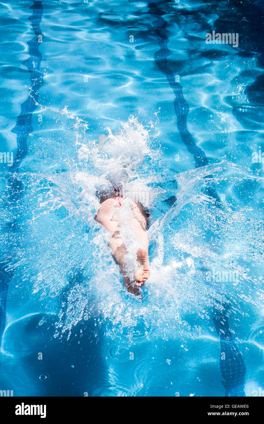 Young women and jumping into pool hi-res stock photography and images ...