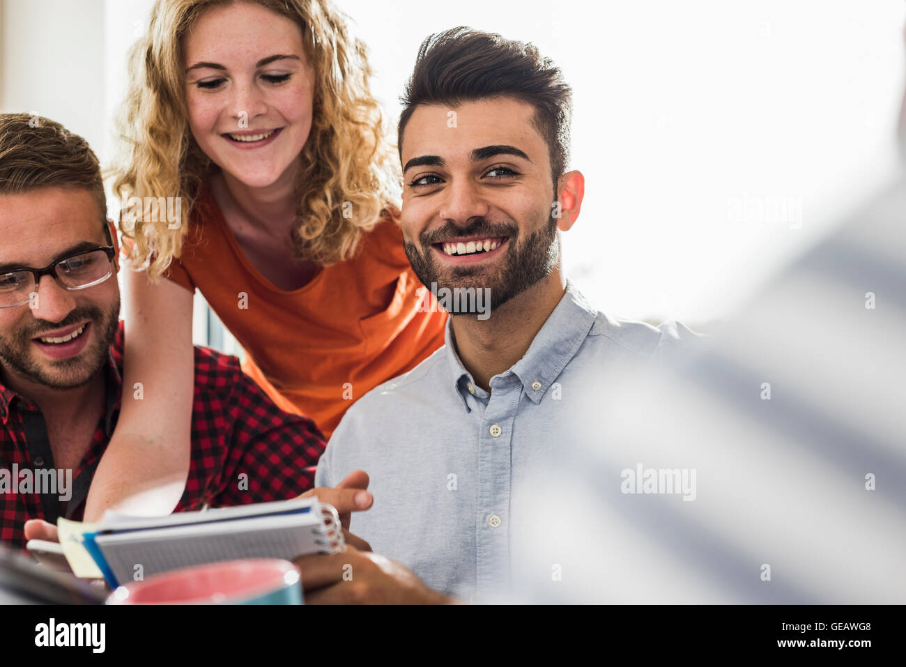 Confident young professionals in office Stock Photo - Alamy