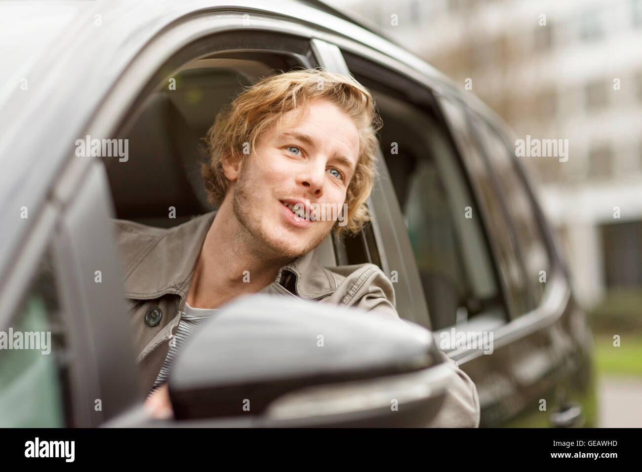 Driver watching through car window hi-res stock photography and images ...