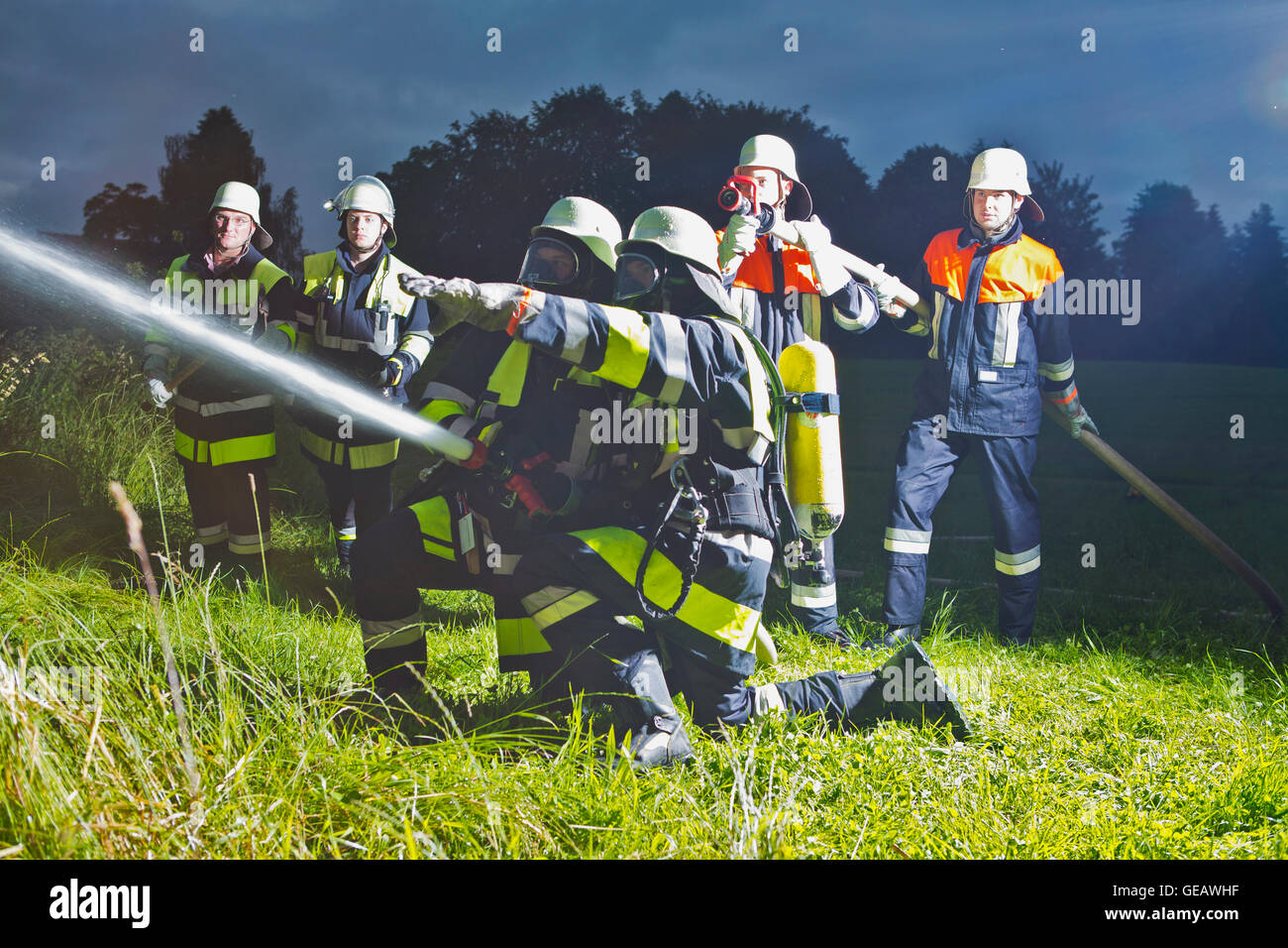 Fire brigade in action Stock Photo - Alamy