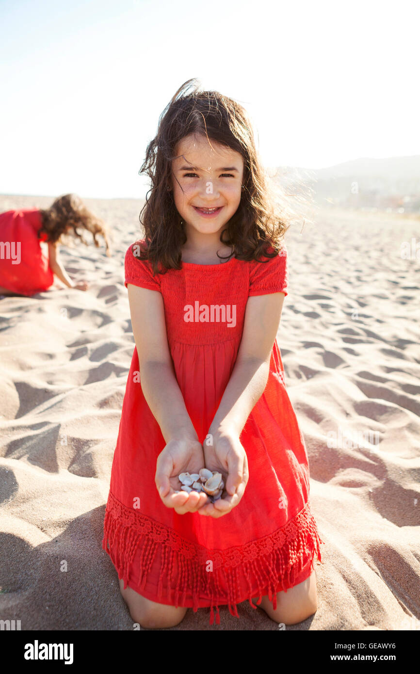 Girl holding seashells hi-res stock photography and images - Alamy