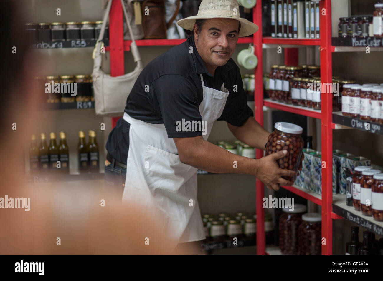 Shopkeeper selling customer hi-res stock photography and images - Alamy