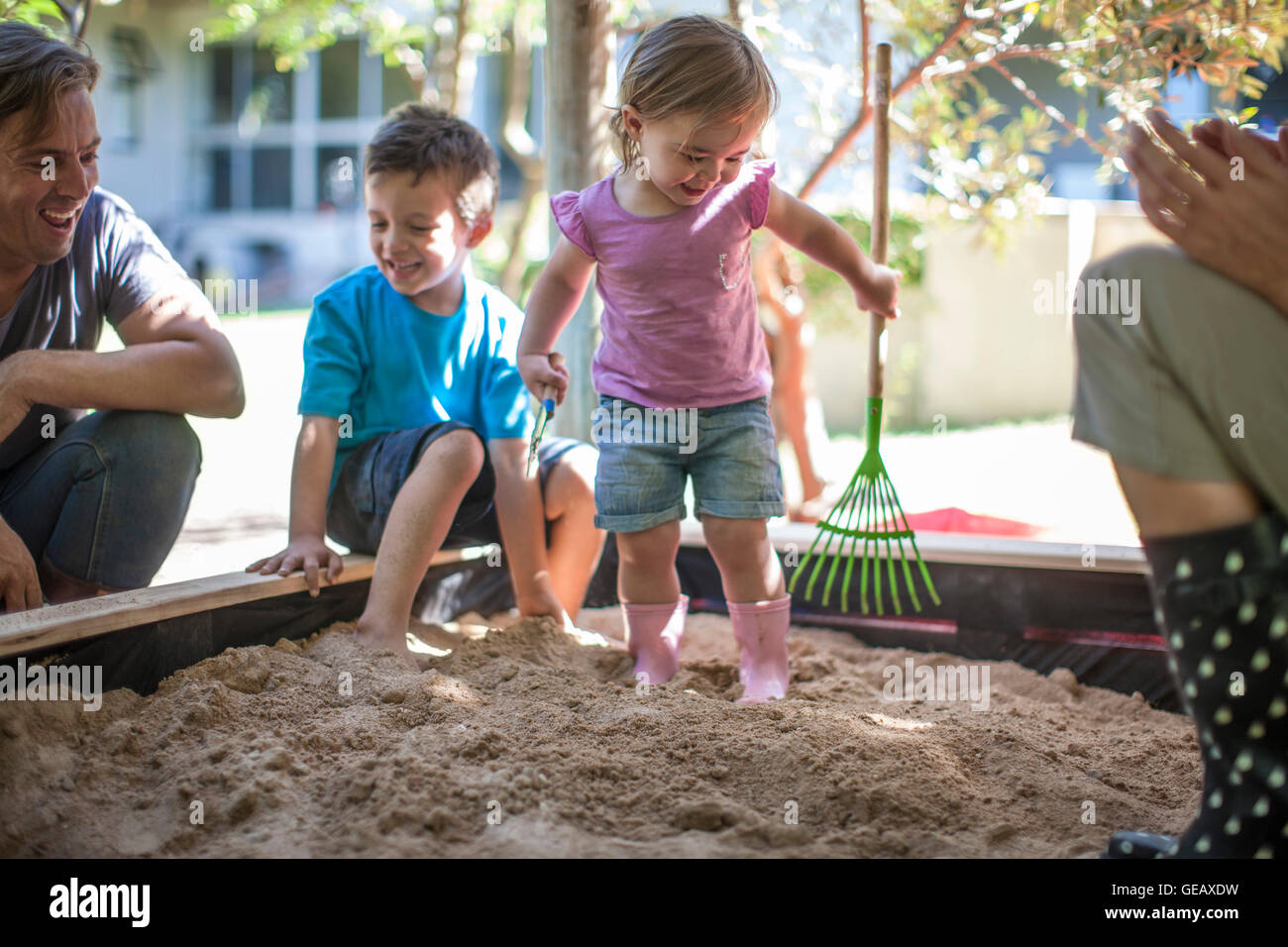 Boy and girl playing sandbox hi-res stock photography and images - Alamy