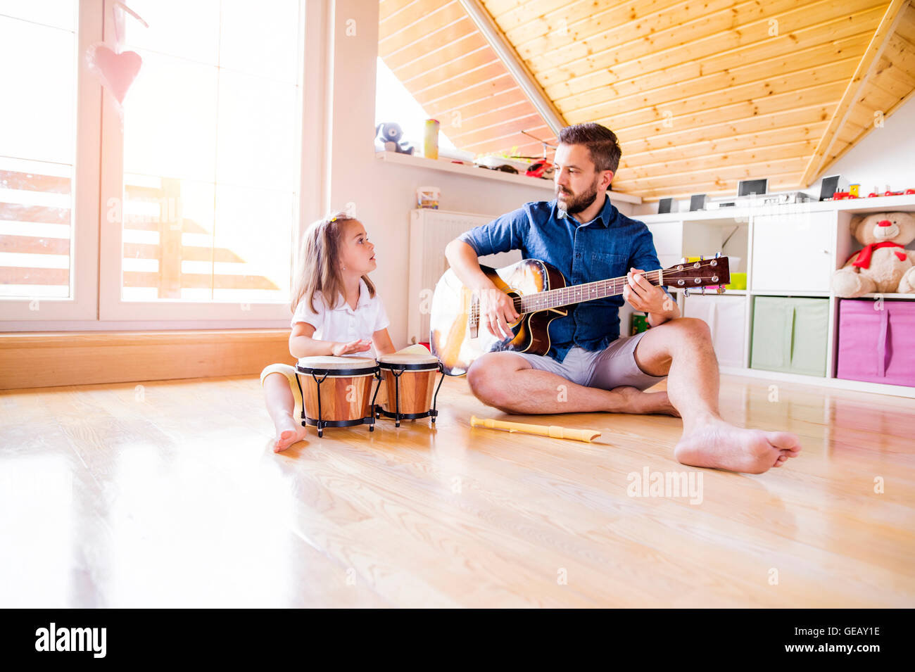 Father and daughter making music together Stock Photo - Alamy