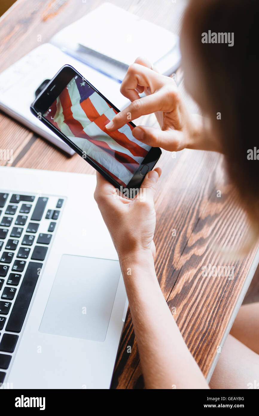 Woman looking pictures on phone hi-res stock photography and images - Alamy