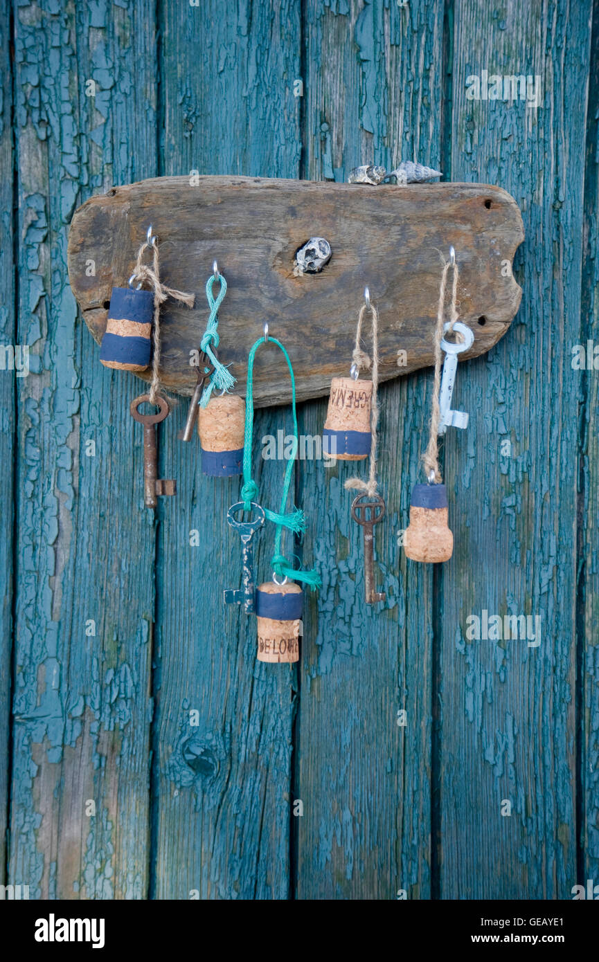 France, Bretagne, old keys on key rack, corks and mussels Stock Photo ...
