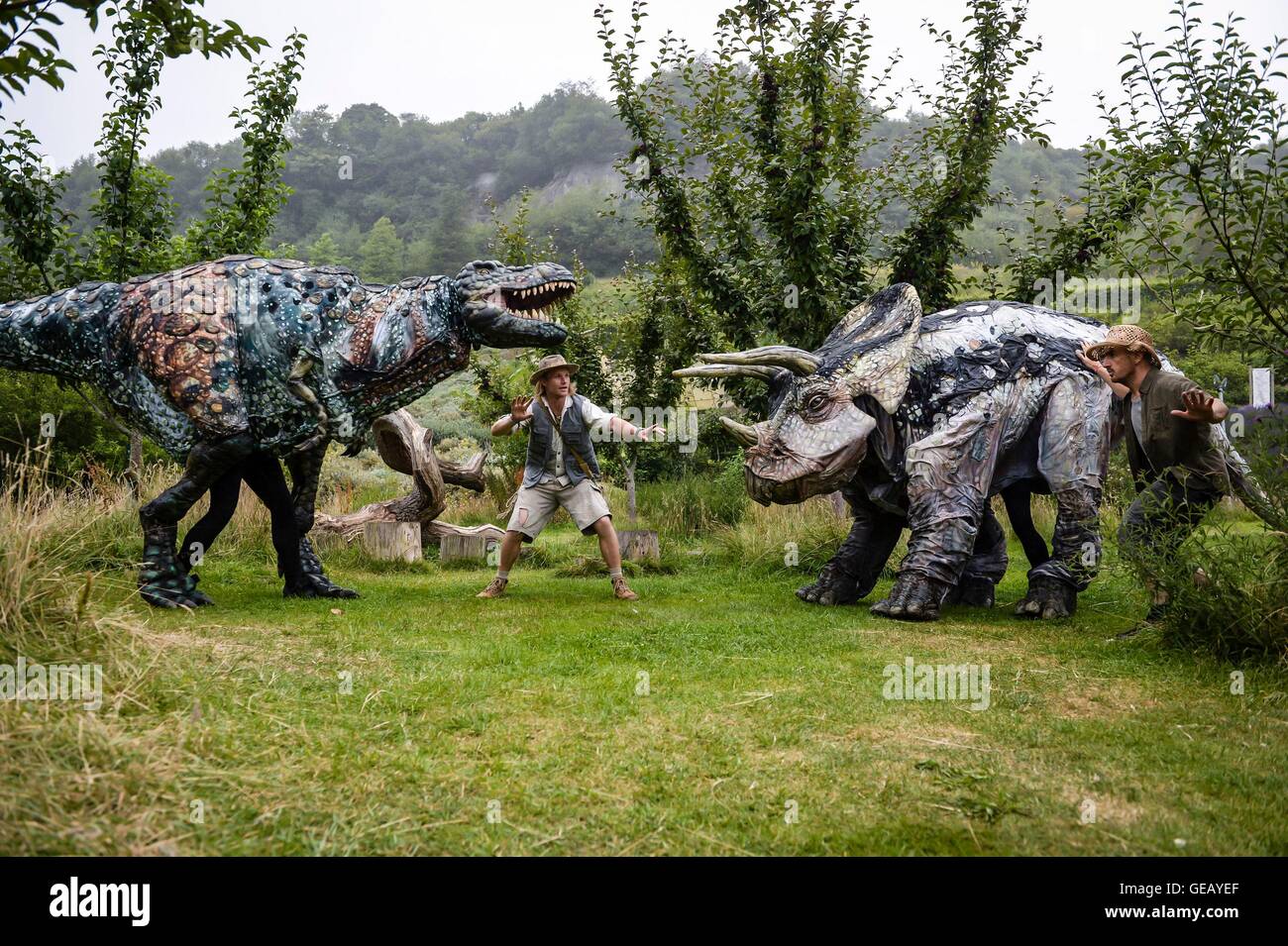 Dinosaur wranglers try to separate human-operated puppets of a T-Rex ...