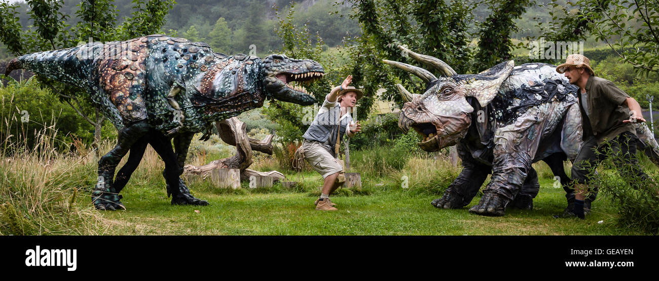 Dinosaur wranglers try to separate human-operated puppets of a T-Rex ...