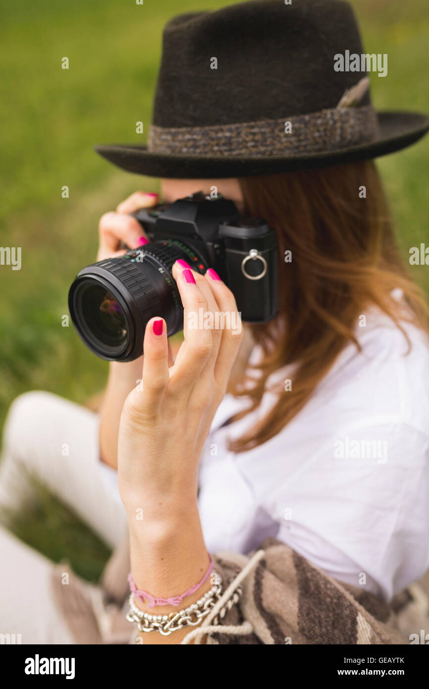 Woman photographing in nature Stock Photo - Alamy
