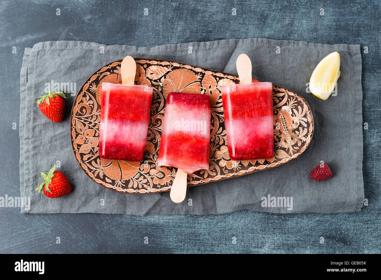 Homemade strawberry raspberry lemon ice lollies Stock Photo - Alamy