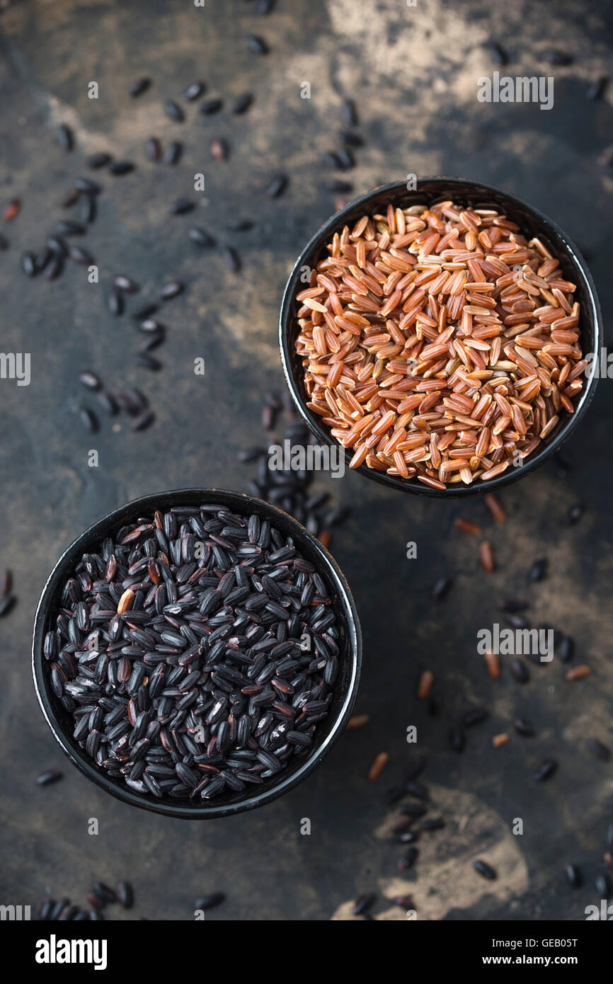 Two bowls of red and black rice Stock Photo - Alamy