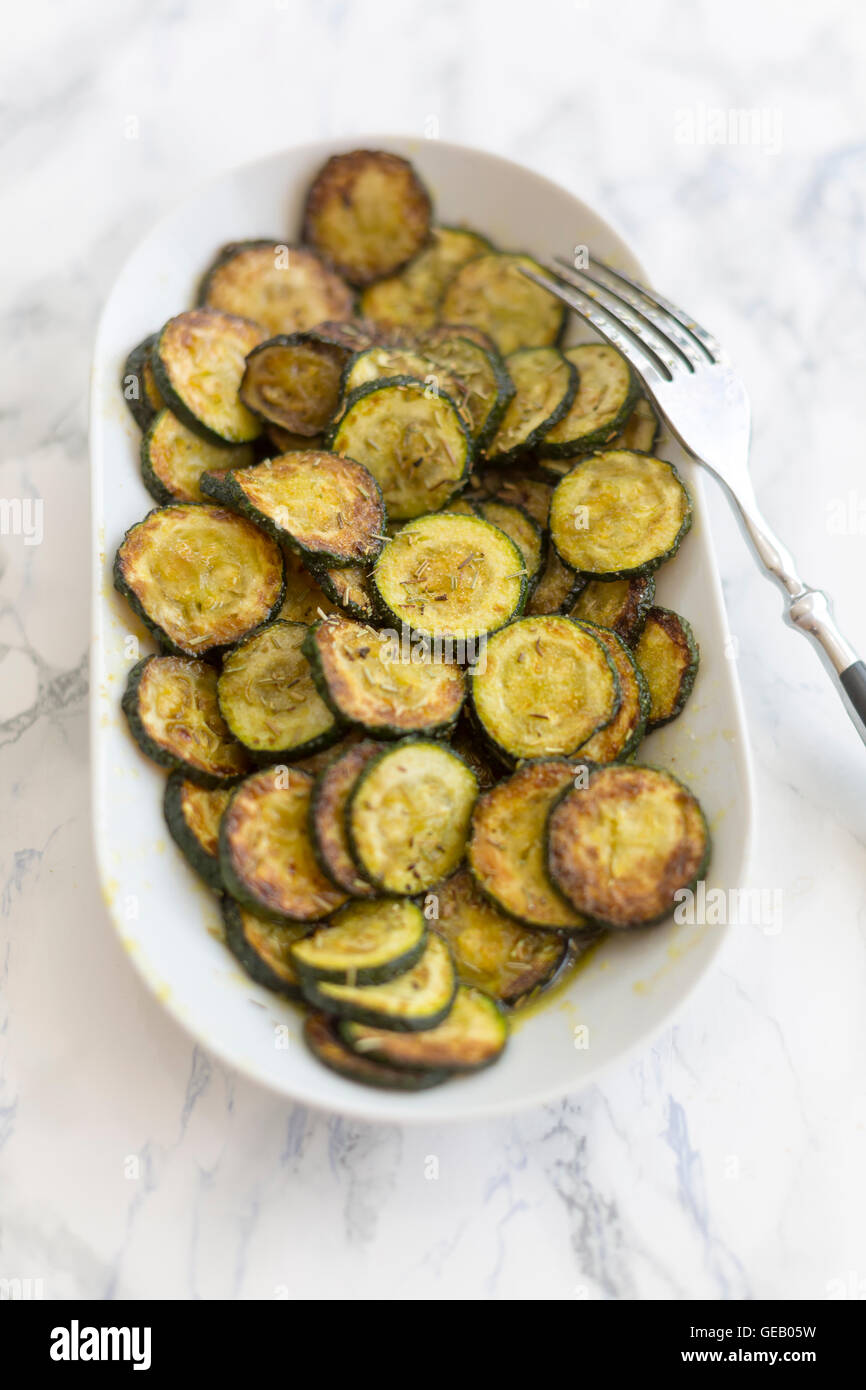 Plate of fried courgette slices Stock Photo - Alamy