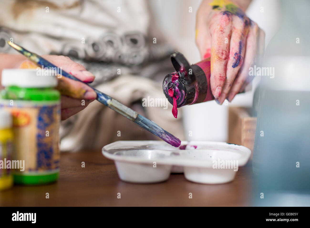 Female painter mixing color, color palette Stock Photo - Alamy