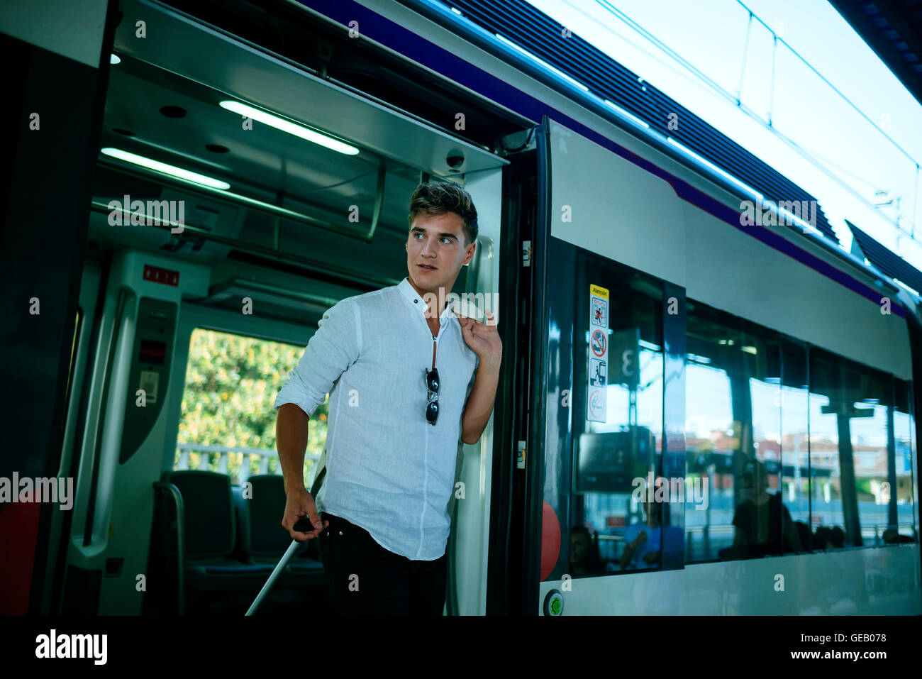 People looking out train door hi-res stock photography and images - Alamy