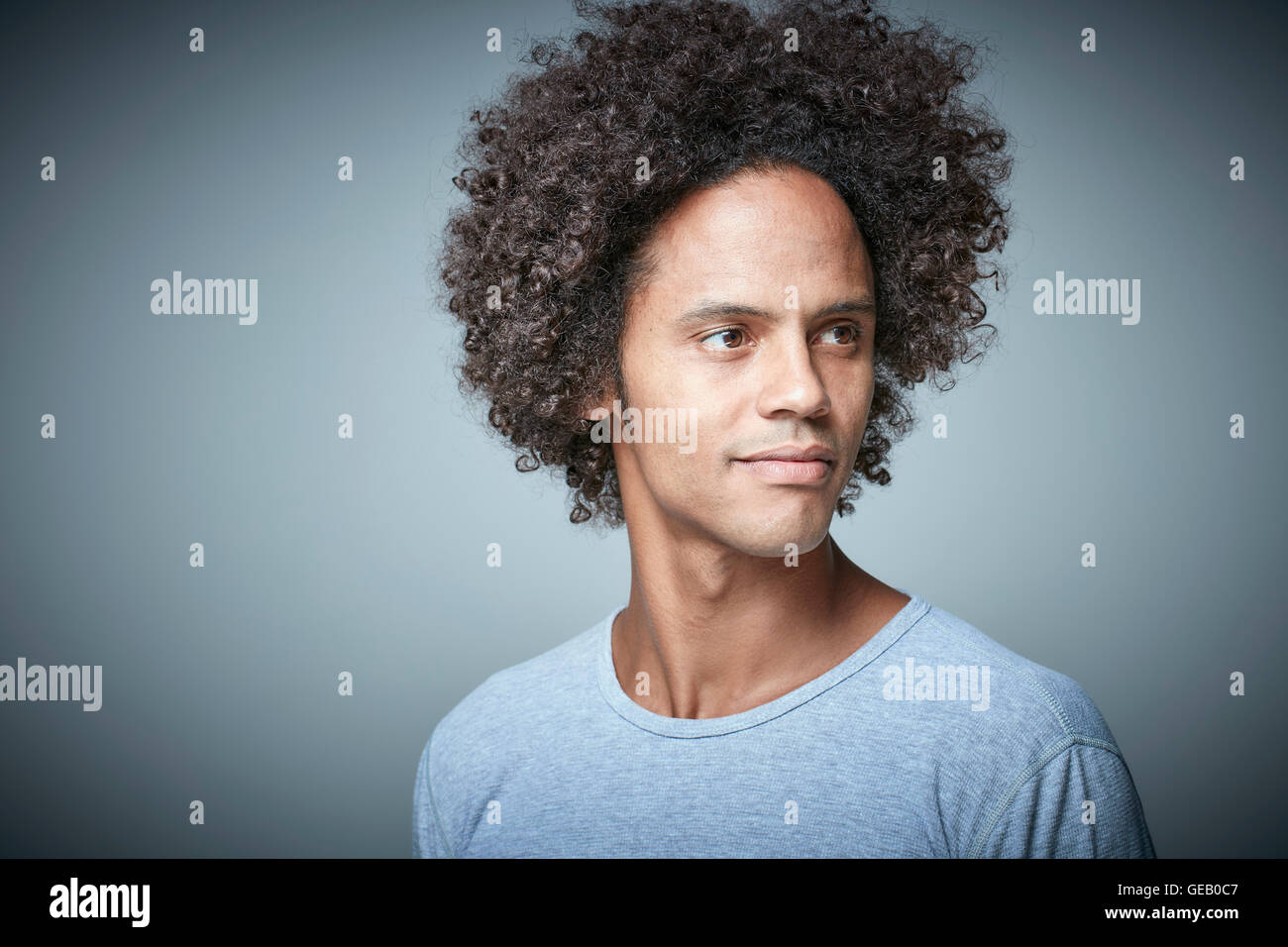 Portrait of relaxed man with afro Stock Photo - Alamy