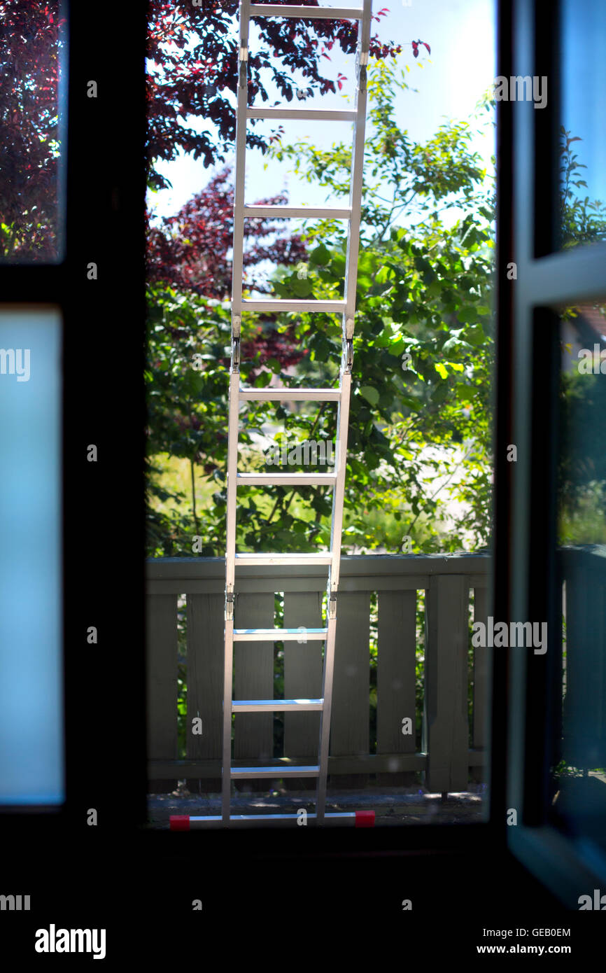 Ladder outside house Stock Photo - Alamy
