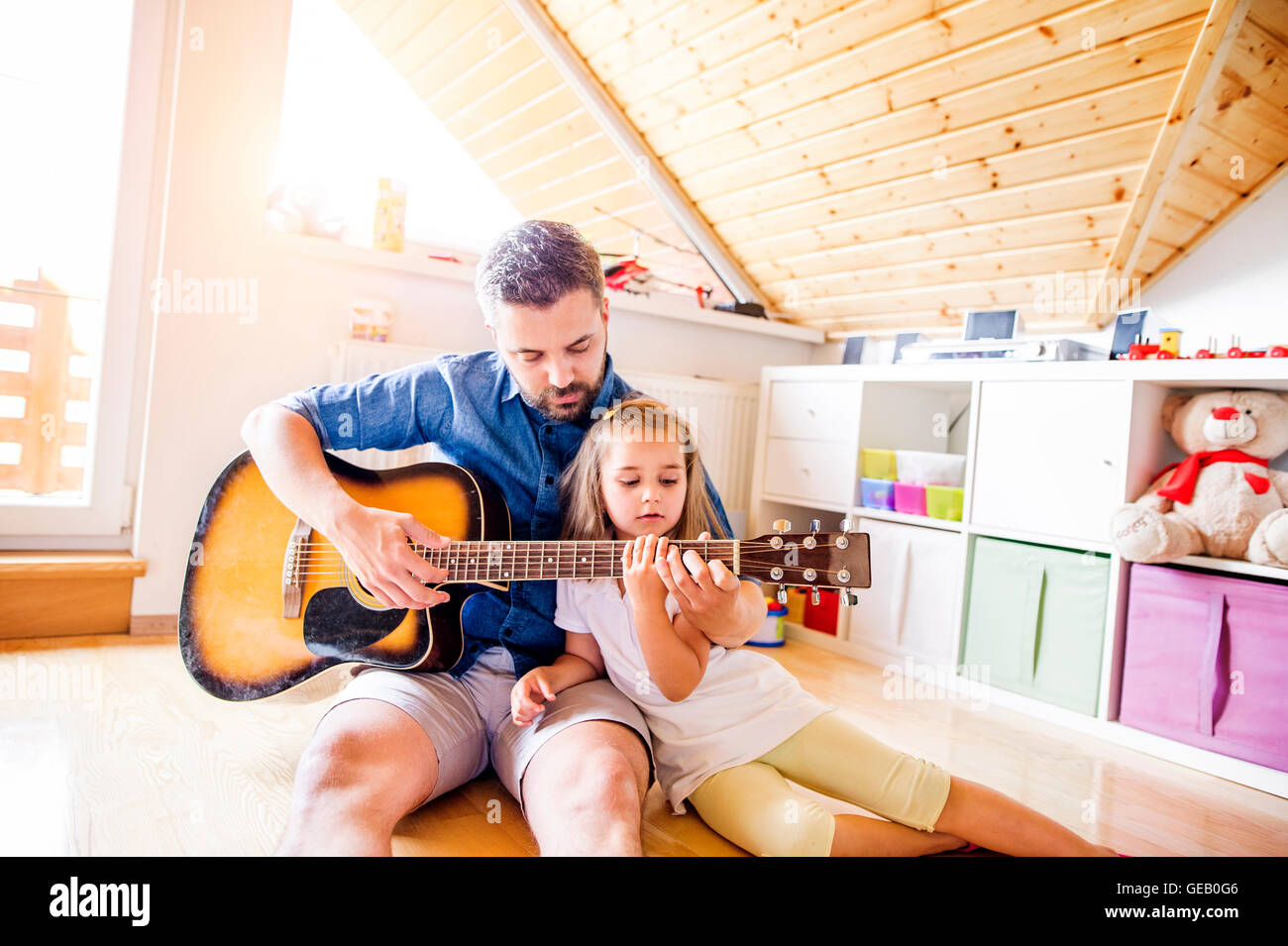 Family making music guitar hi-res stock photography and images - Alamy