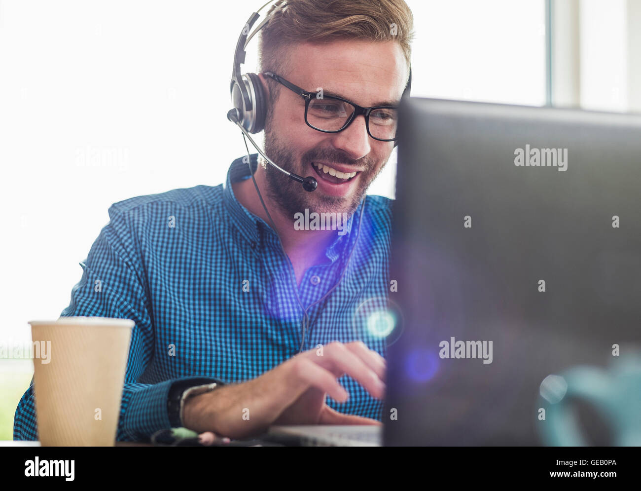 Man with telephone headset hi-res stock photography and images - Alamy