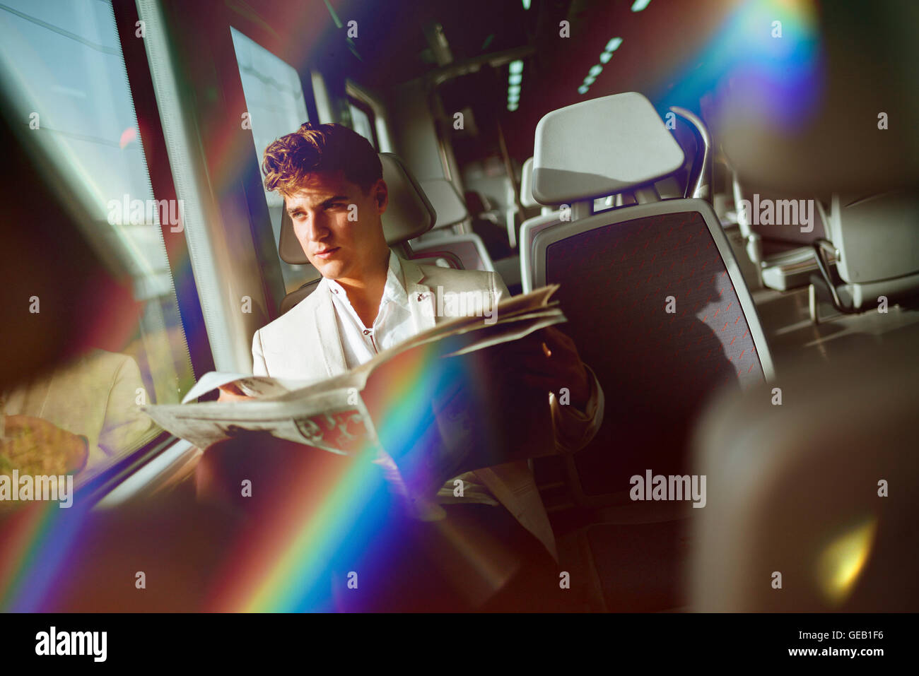 Man train reading newspaper hi-res stock photography and images - Alamy