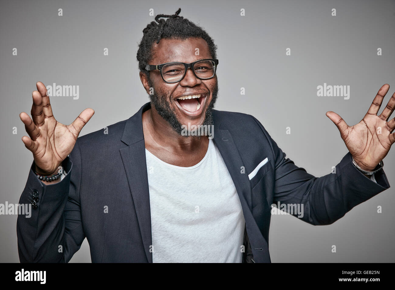 Portrait of laughing man wearing glasses and jacket Stock Photo - Alamy