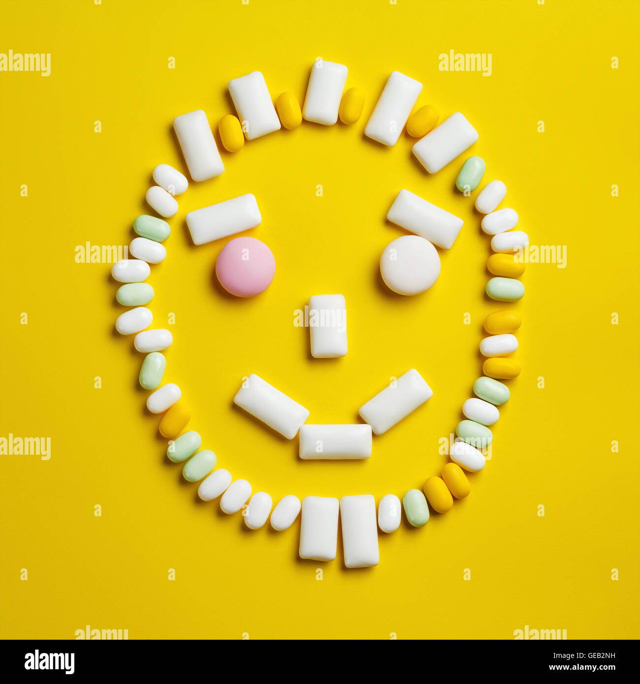 Funny round smily face made of different chewing gums, mint candies and ...