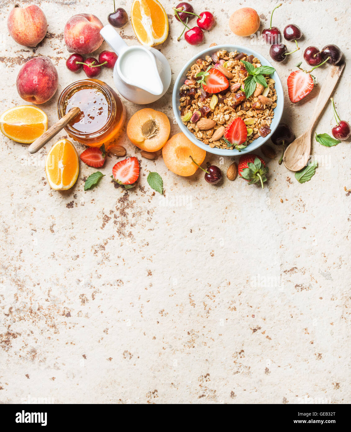 Healthy breakfast ingredients. Bowl of oat granola with milk, fresh ...