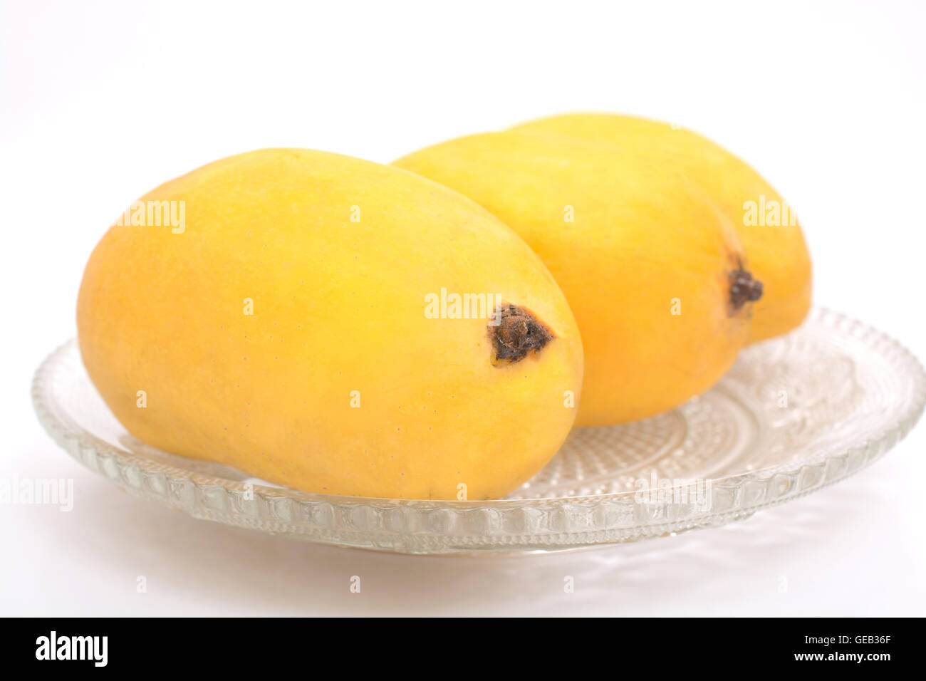 Fresh ripe chaunsa mangoes with basket on white background Stock Photo ...