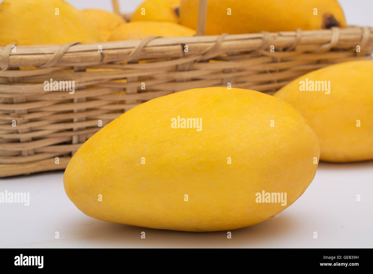 Fresh ripe chaunsa mangoes with basket on white background Stock Photo ...