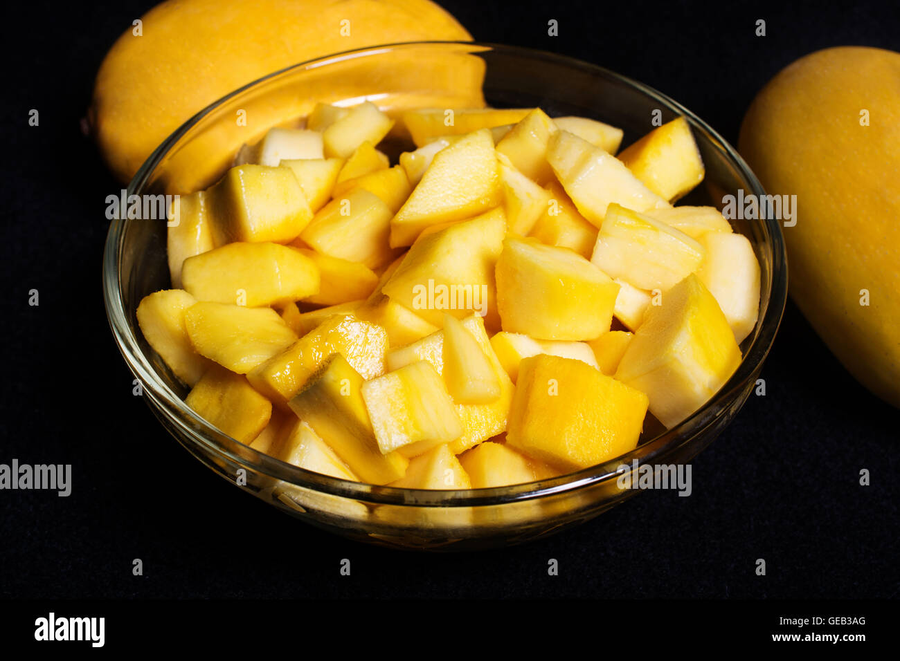 fresh and juicy slice of mango in bowl Stock Photo - Alamy