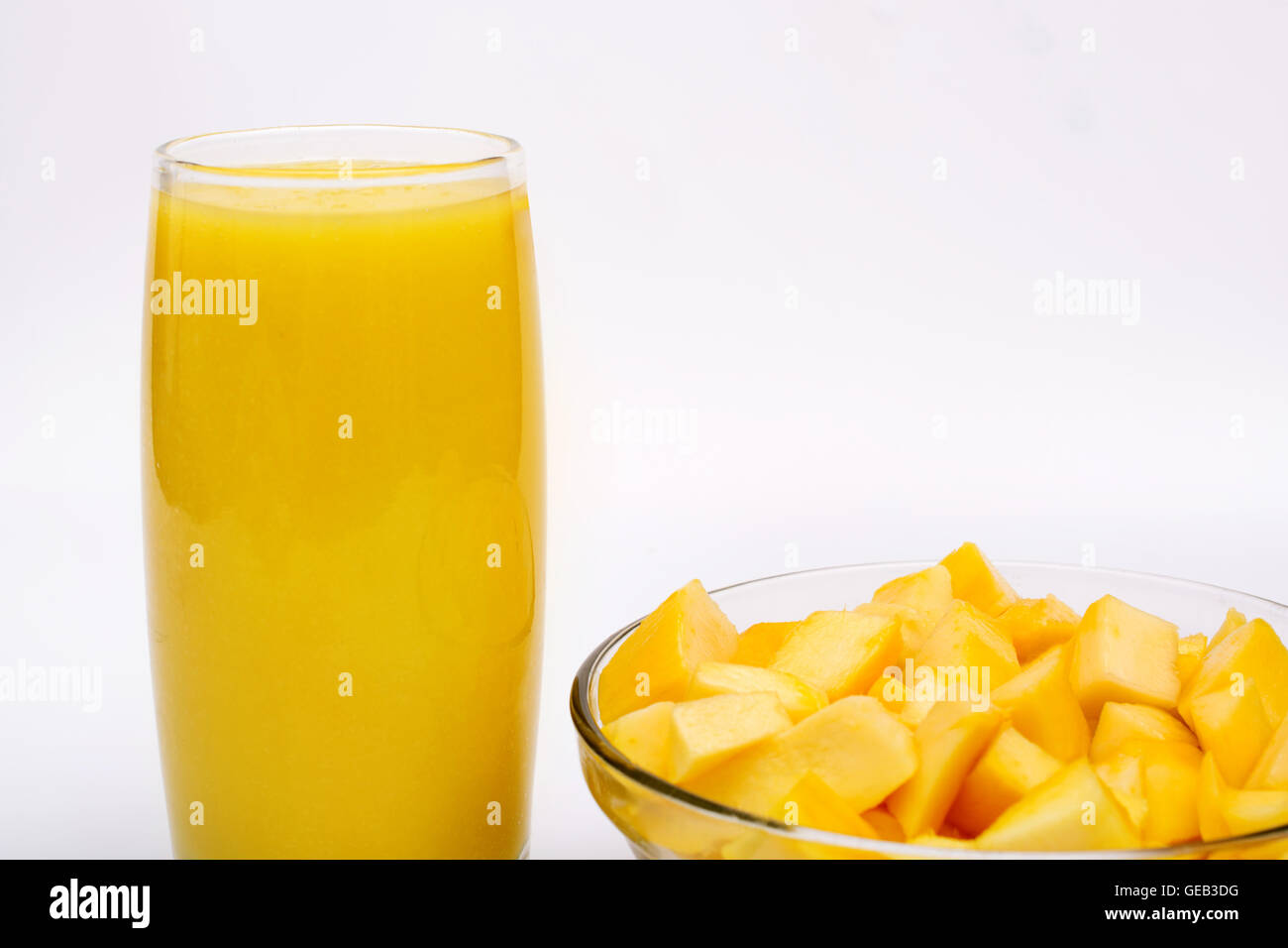 Fresh golden mango served with smoothie on white Stock Photo - Alamy