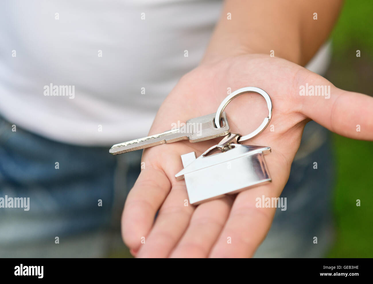house key in a woman hand Stock Photo - Alamy