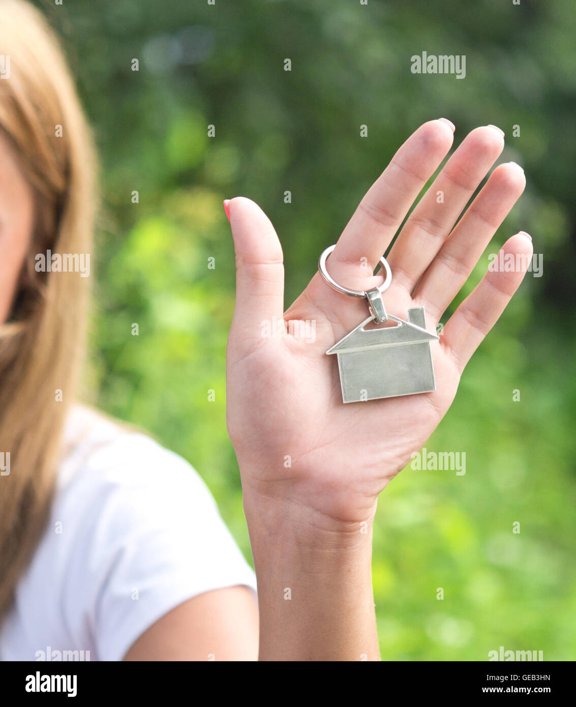Woman handing over key hi-res stock photography and images - Alamy