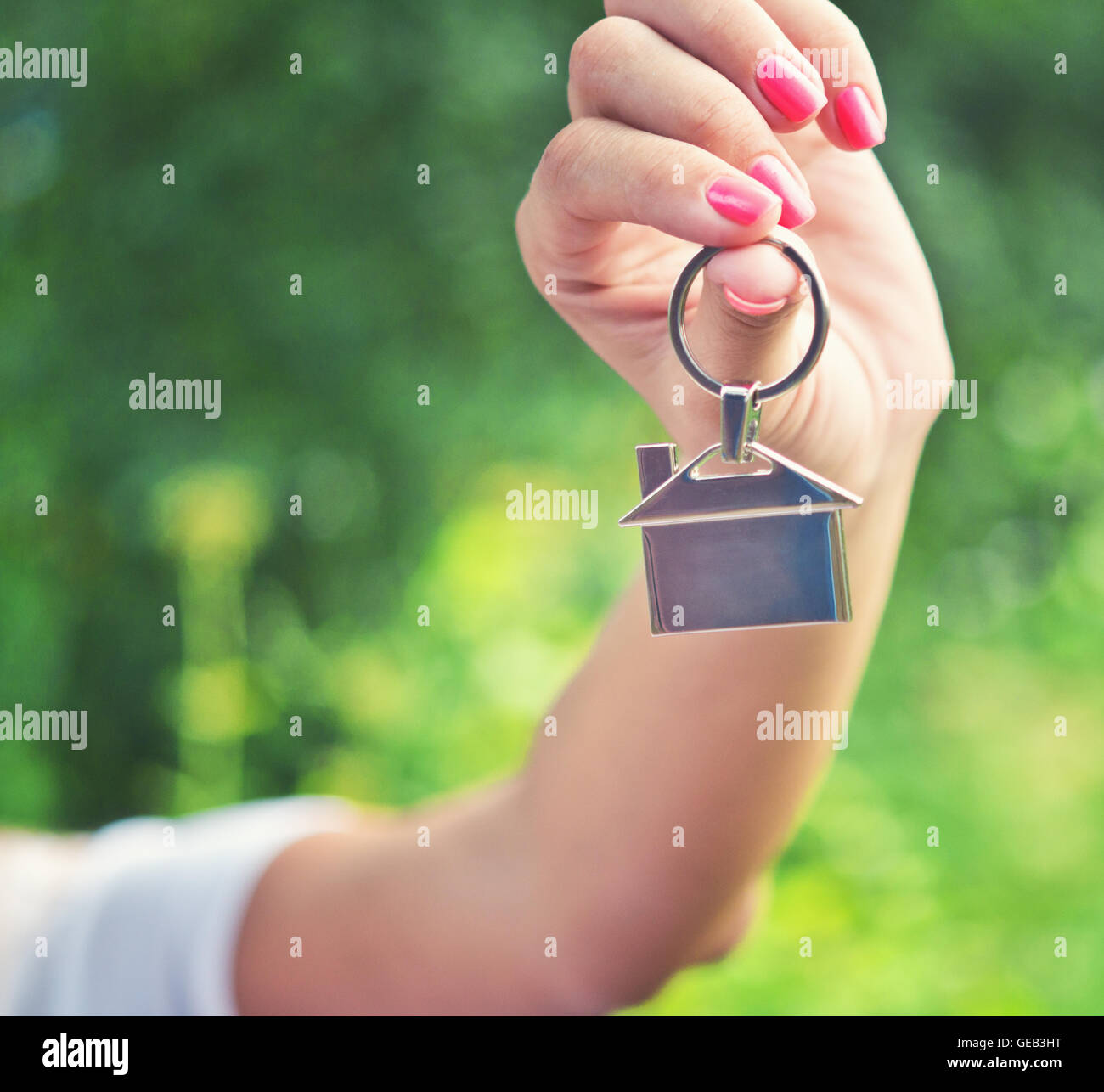 Woman handing over key hi-res stock photography and images - Alamy