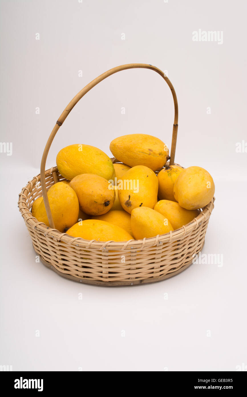 Fresh ripe chaunsa mangoes with basket on white background Stock Photo ...