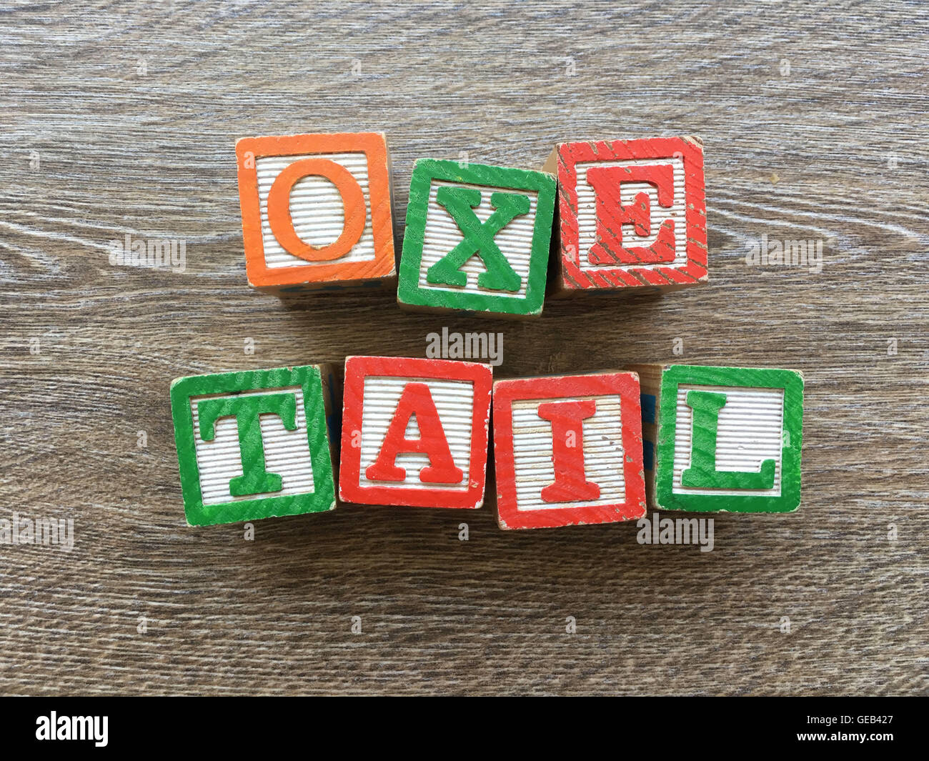 OXE TAIL sentence written with wood block letter characters Stock Photo ...