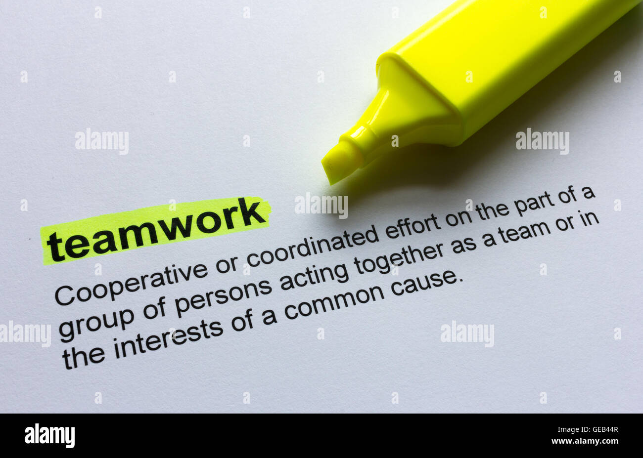 Definition of teamwork, highlighted in colour Stock Photo - Alamy