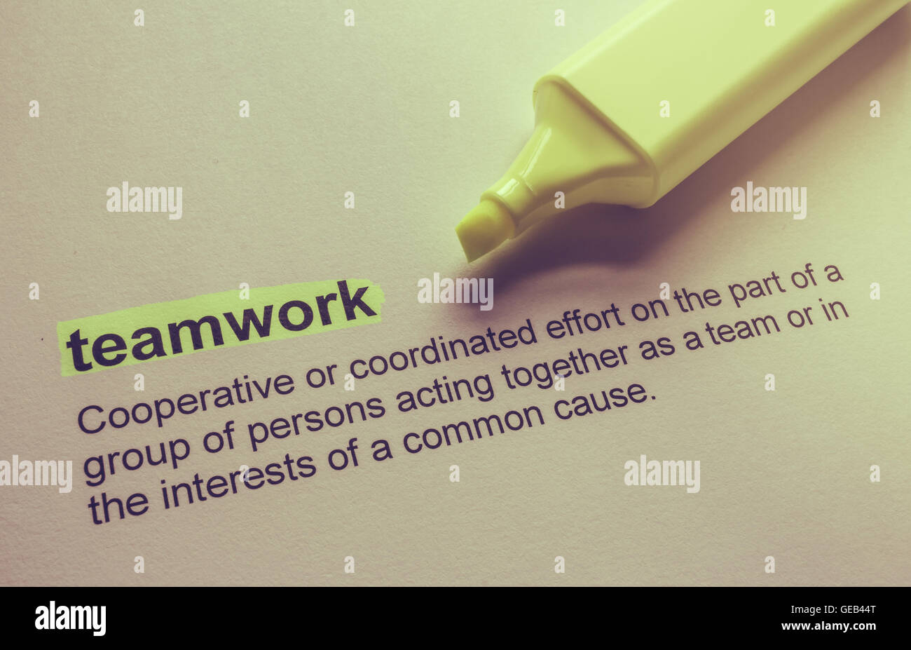 Definition of teamwork, highlighted in colour Stock Photo - Alamy