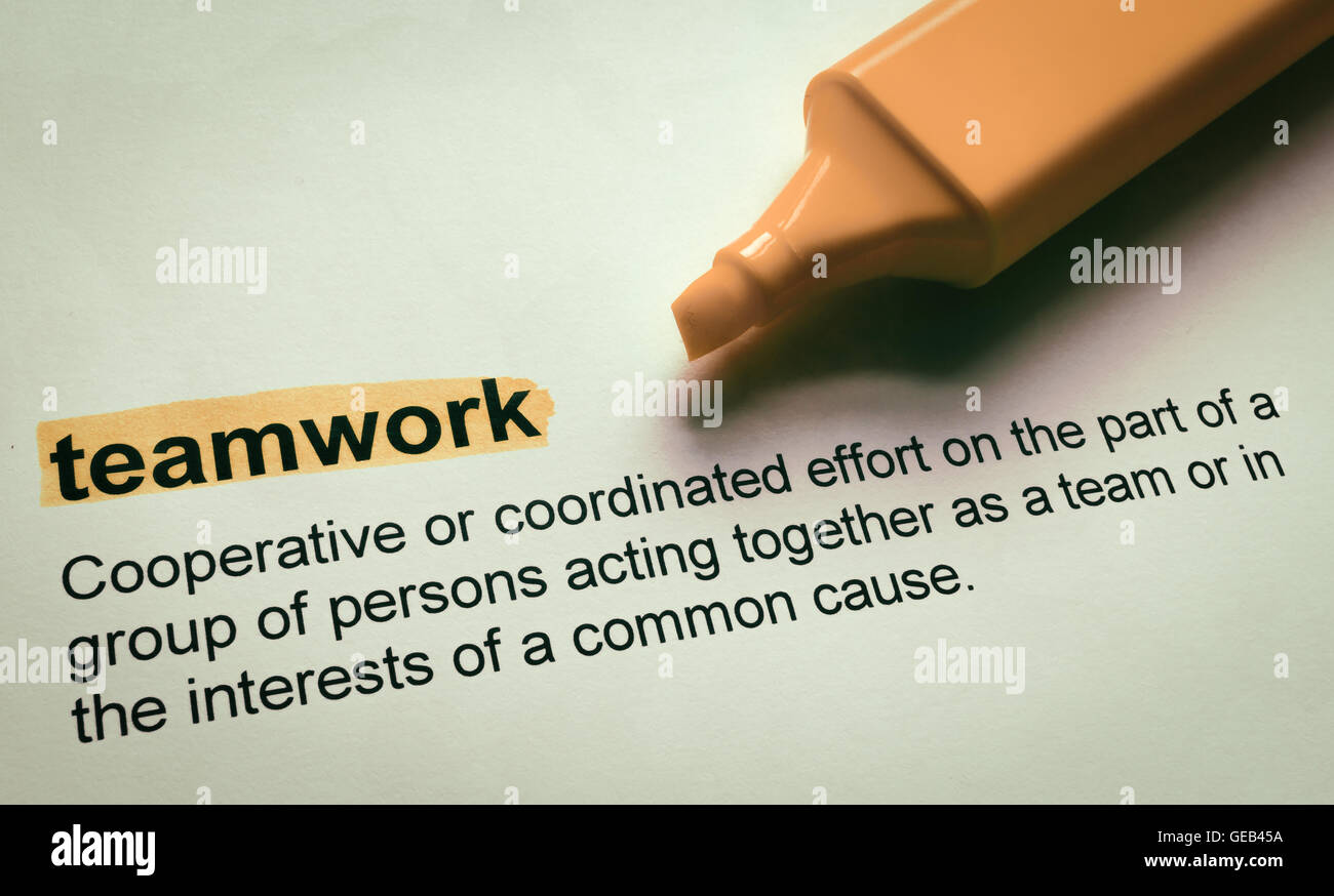 Definition of teamwork, highlighted in colour Stock Photo - Alamy