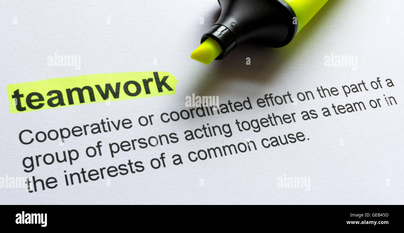 Definition of teamwork, highlighted in colour Stock Photo - Alamy